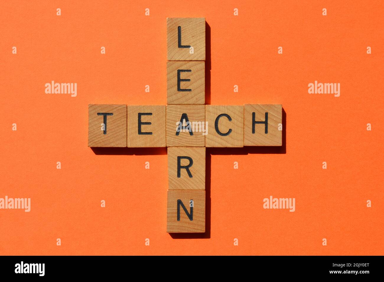 Teach, Learn, words in wooden alphabet letters in crossword form ...