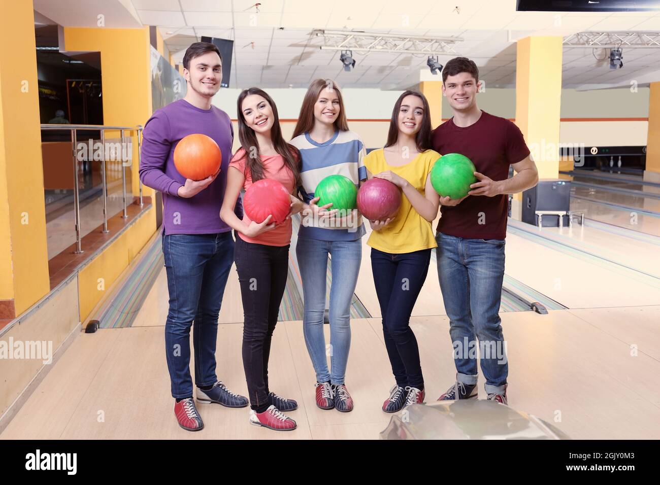 Friends having fun at bowling club Stock Photo - Alamy
