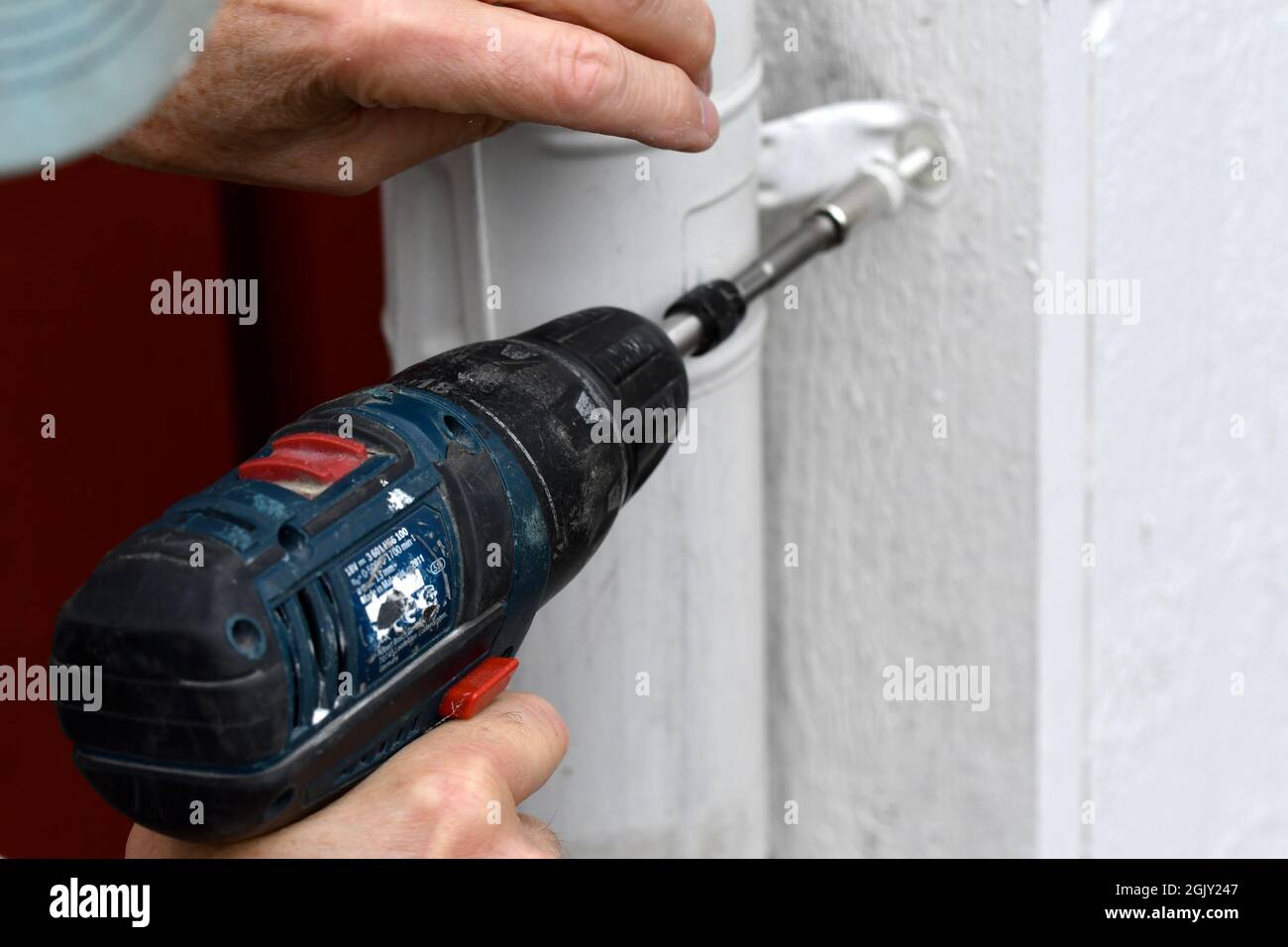 Man working using drill machine hi-res stock photography and images - Alamy