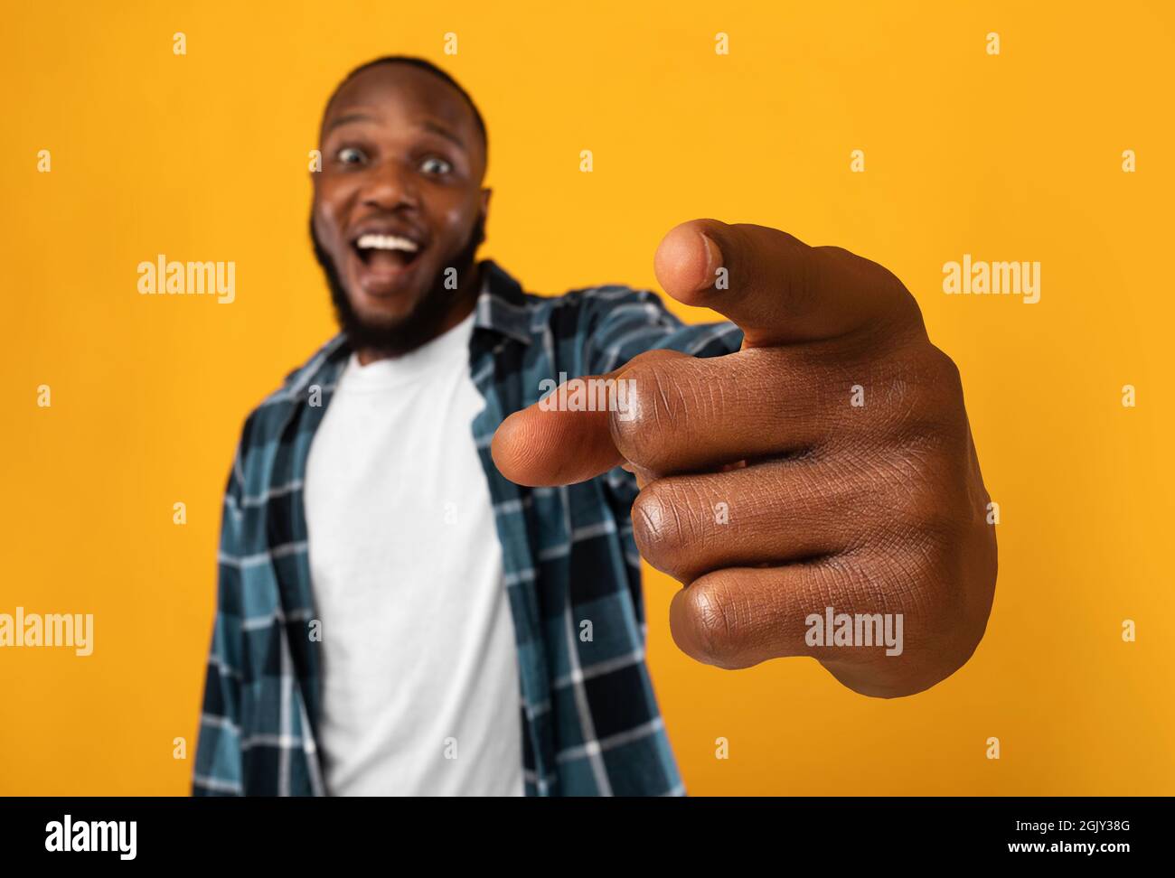 Excited African Man Pointing At Camera, Yellow Background Stock Photo ...