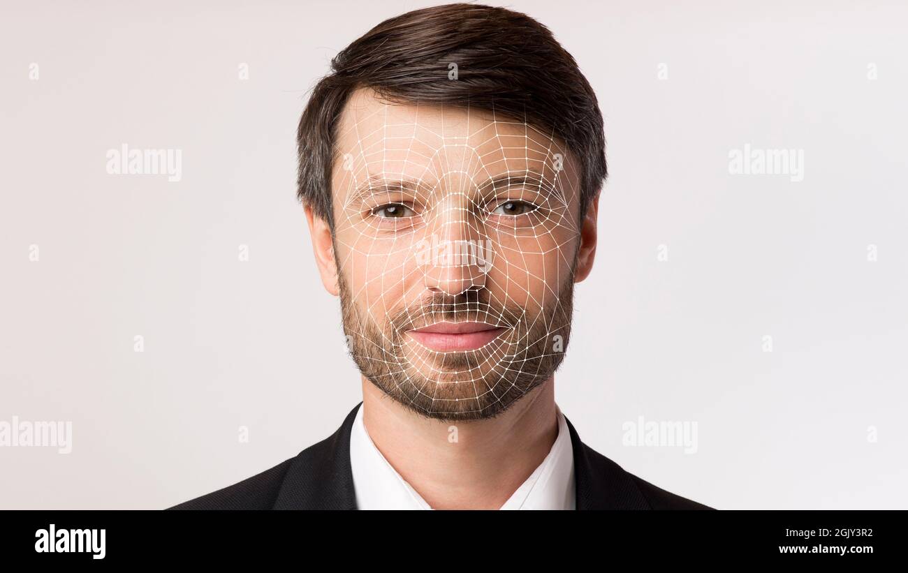 Portrait of handsome businessman on grey. Biometric verification, face ...