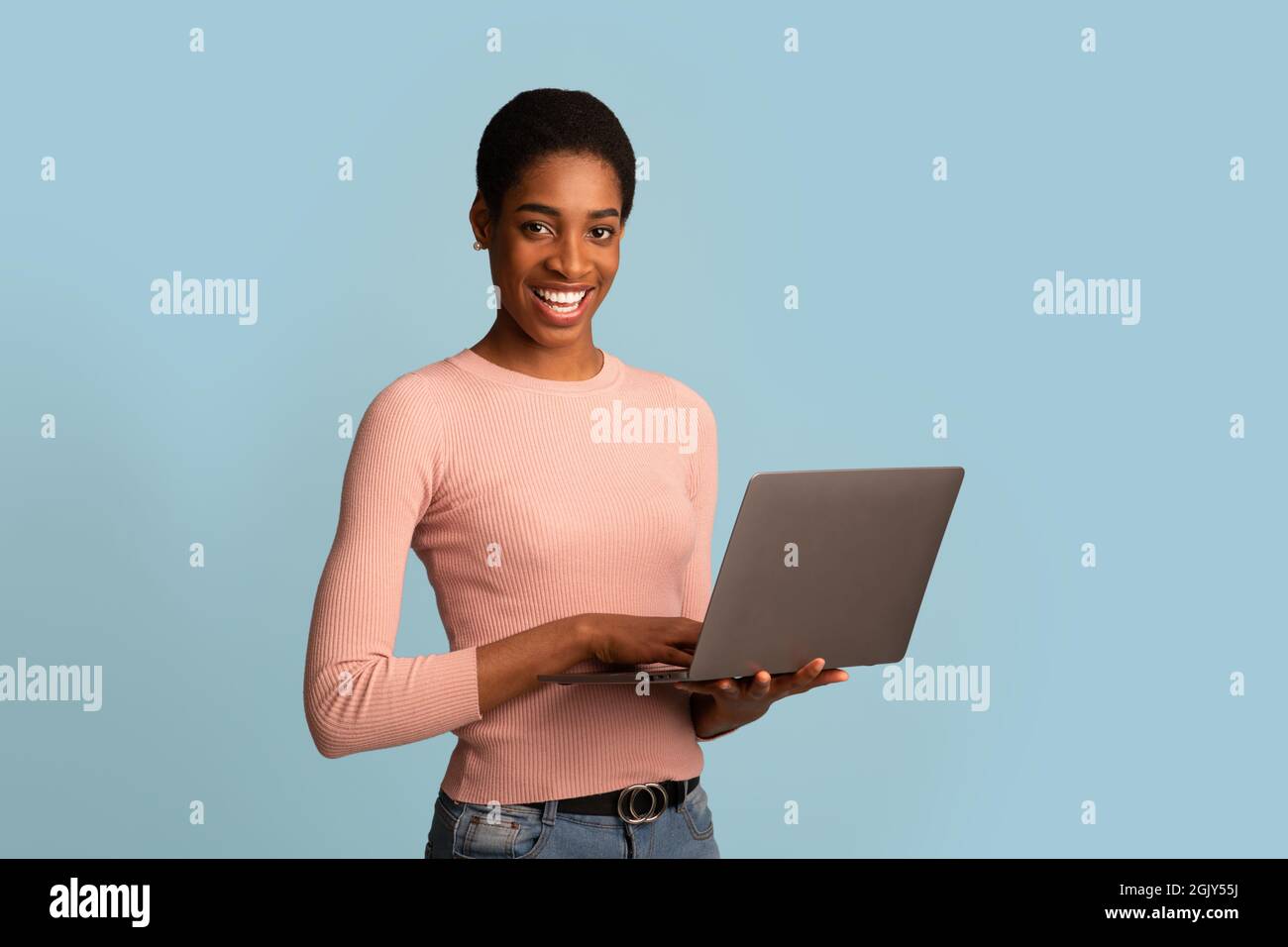 Portrait cheerful black woman laptop hi-res stock photography and ...