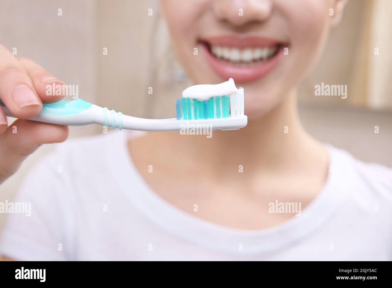 Beautiful woman brushing teeth, closeup Stock Photo - Alamy
