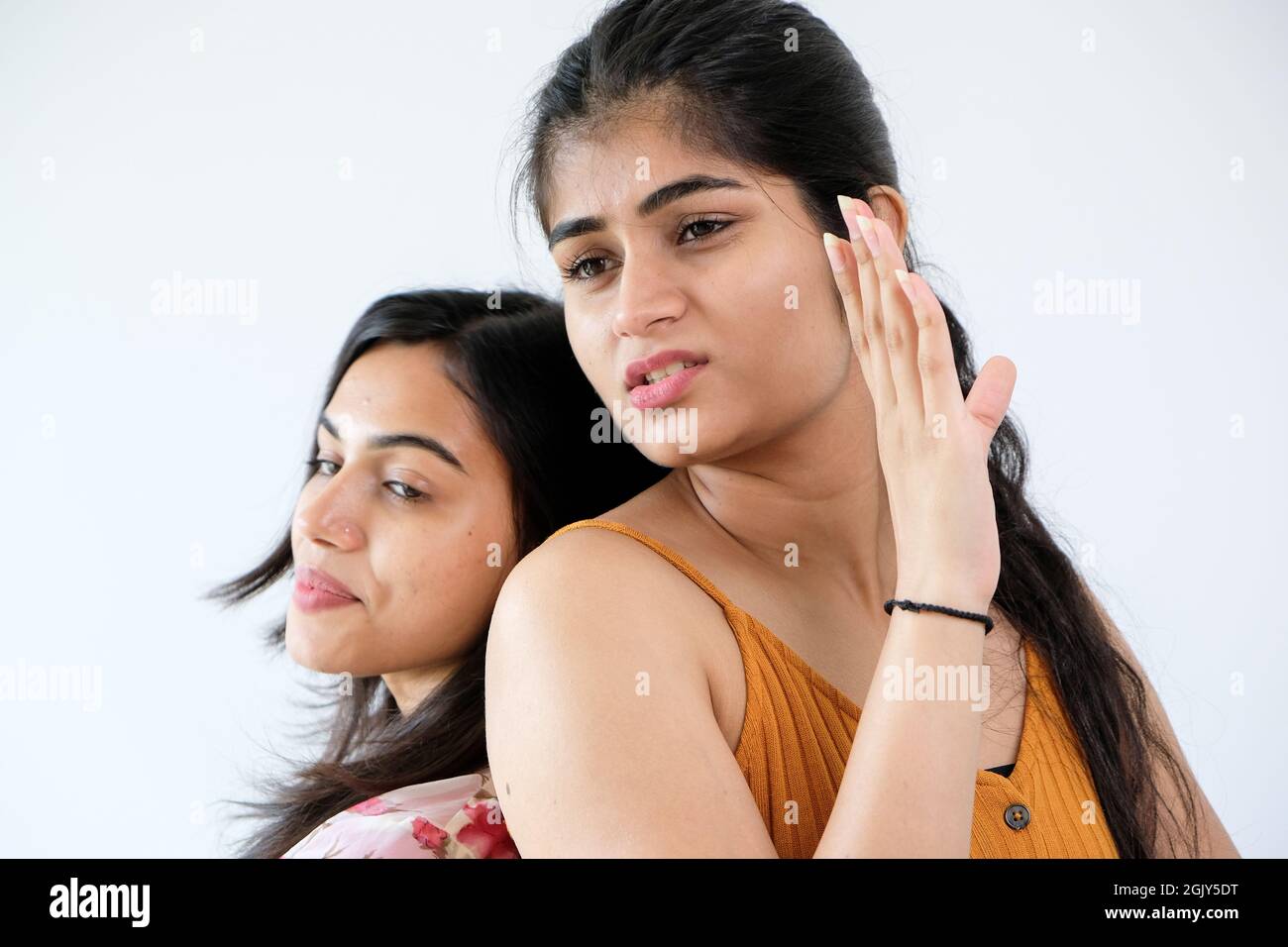 Two Indian best friends posing on a white background Stock Photo - Alamy