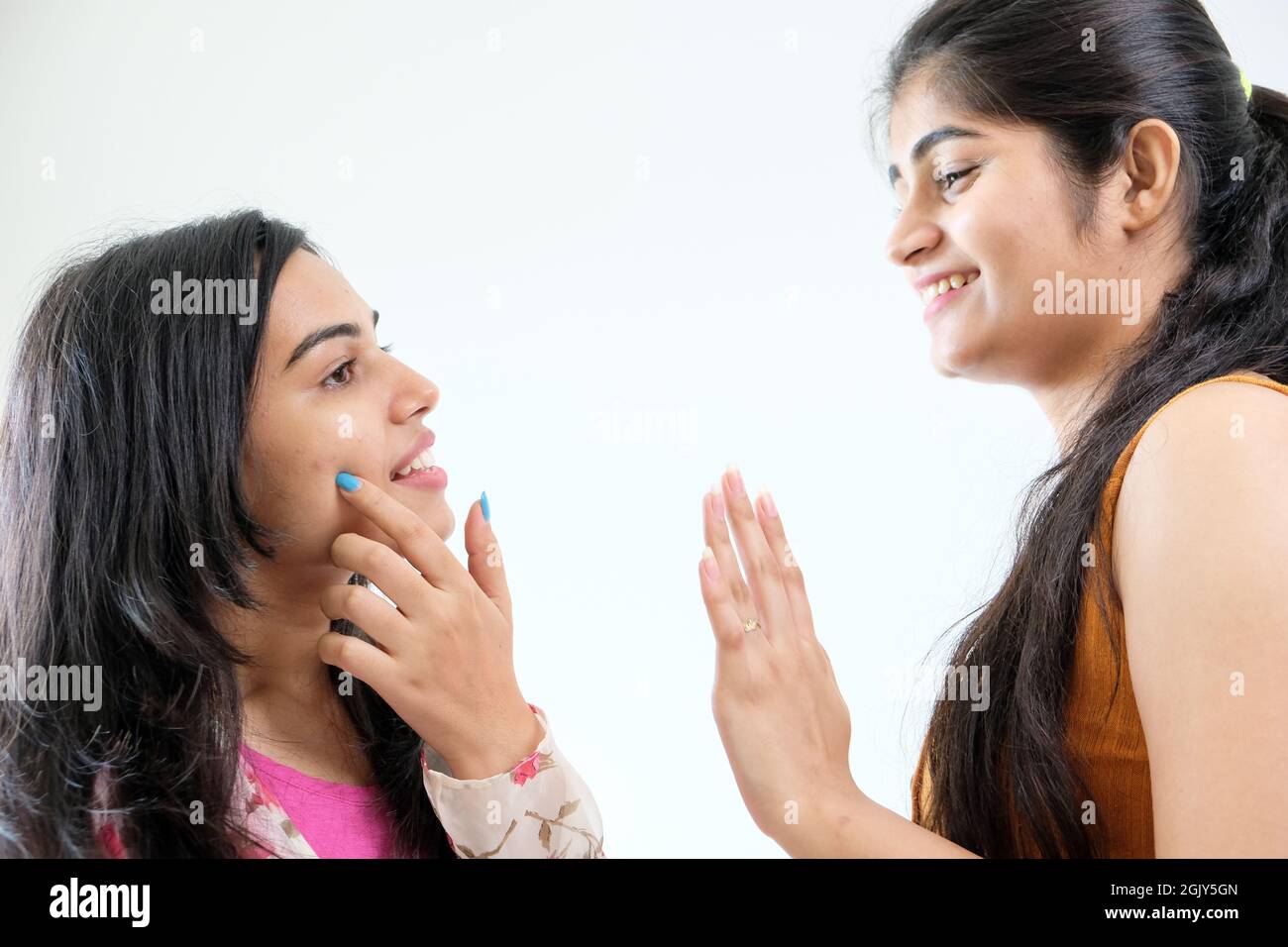Two Indian best friends happily talking to each other Stock Photo - Alamy
