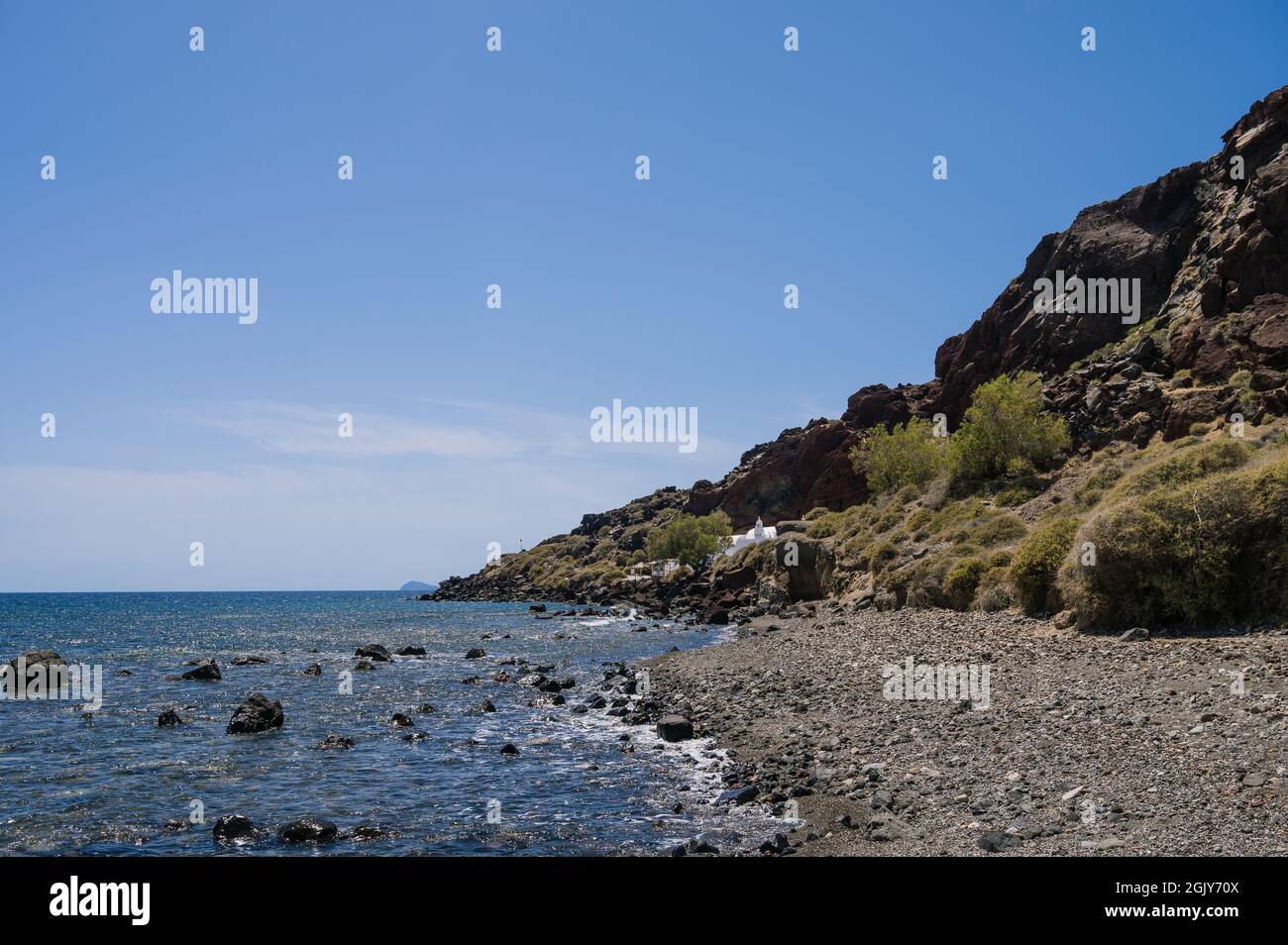 Scenic landscape of black stones in Aegean sea. Rock near water. Blue ...