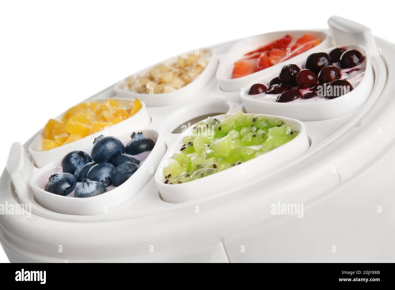 Automatic yogurt maker with fruits on white background Stock Photo - Alamy