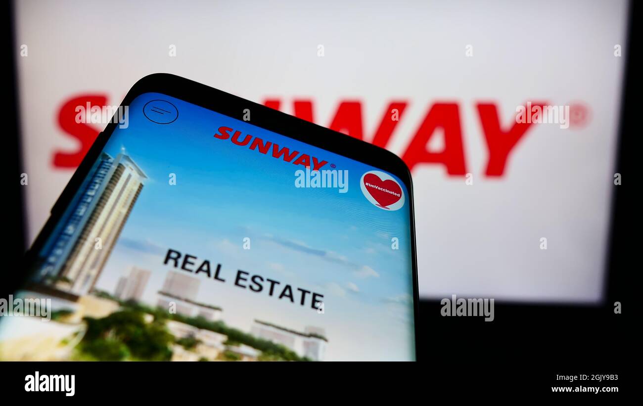 Cellphone with web page of Malaysian conglomerate Sunway Berhad on ...