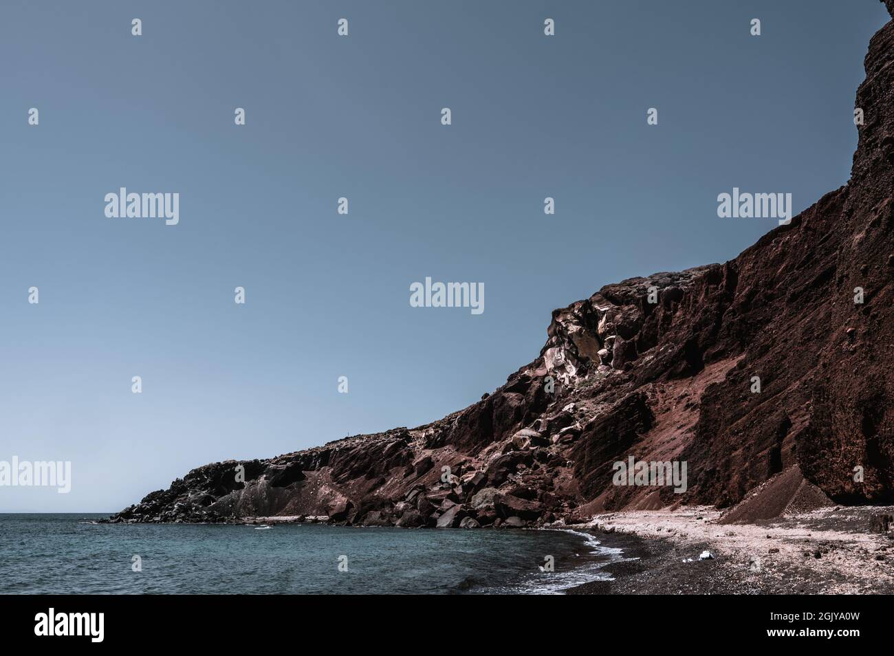 Scenic landscape of red sand beach near Akrotiri village on Santorini ...