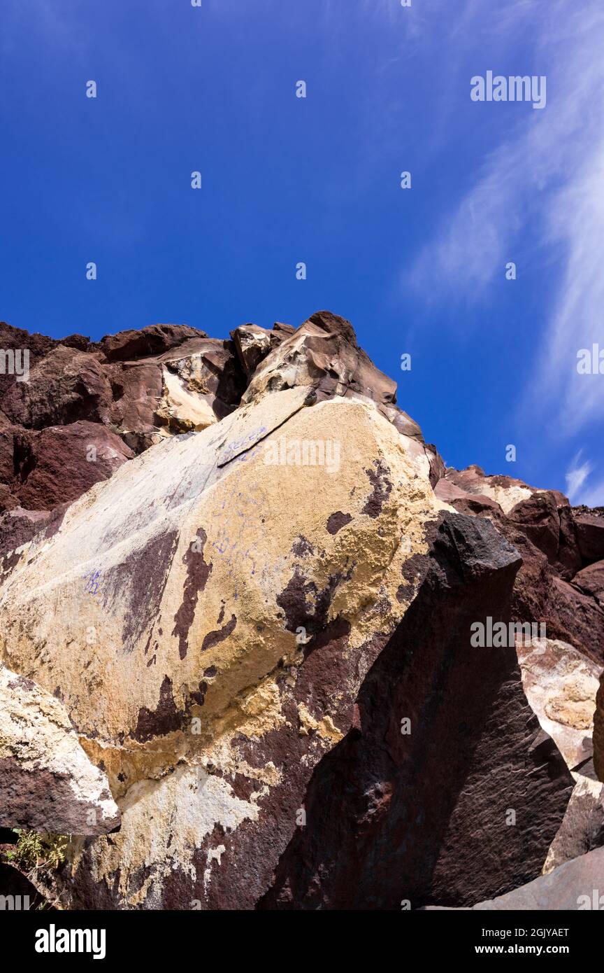 Huge red and yellow rock cliff on red sand beach Santorini. Alien ...