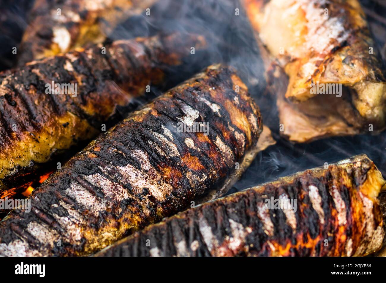 Grilled fish on charcoal grill. Fresh fish barbecue Stock Photo - Alamy