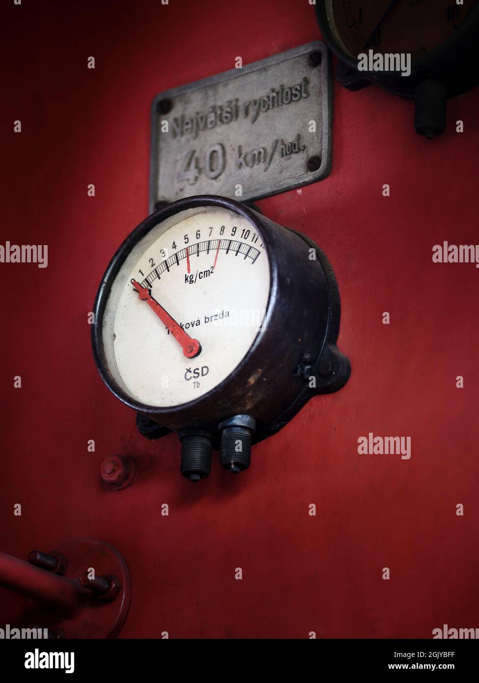 Detail of a pressure brake indicator on an old broken red locomotive ...