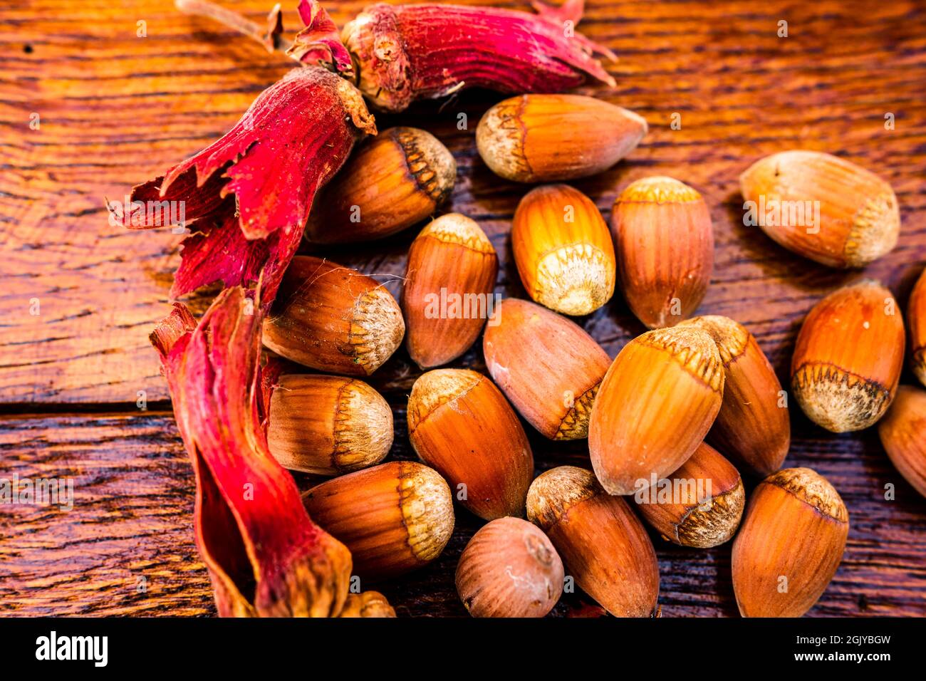 Fresh ripe red hazelnuts on wooden table Stock Photo - Alamy