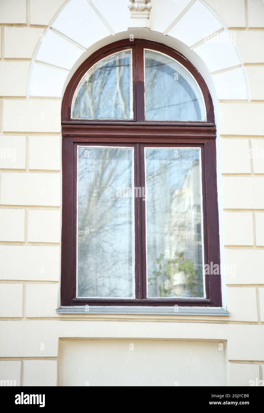 Vintage building with arched wooden window Stock Photo - Alamy
