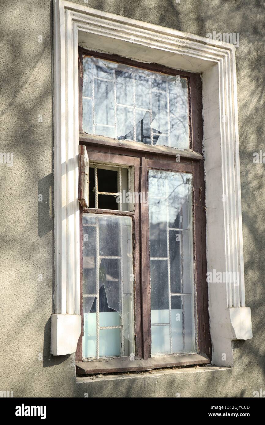 Old vintage window with broken glass Stock Photo - Alamy