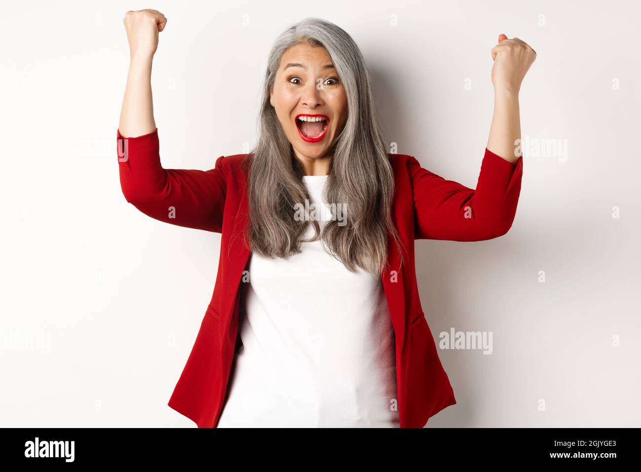 Lucky senior woman achieve success, winning prize and celebrating ...