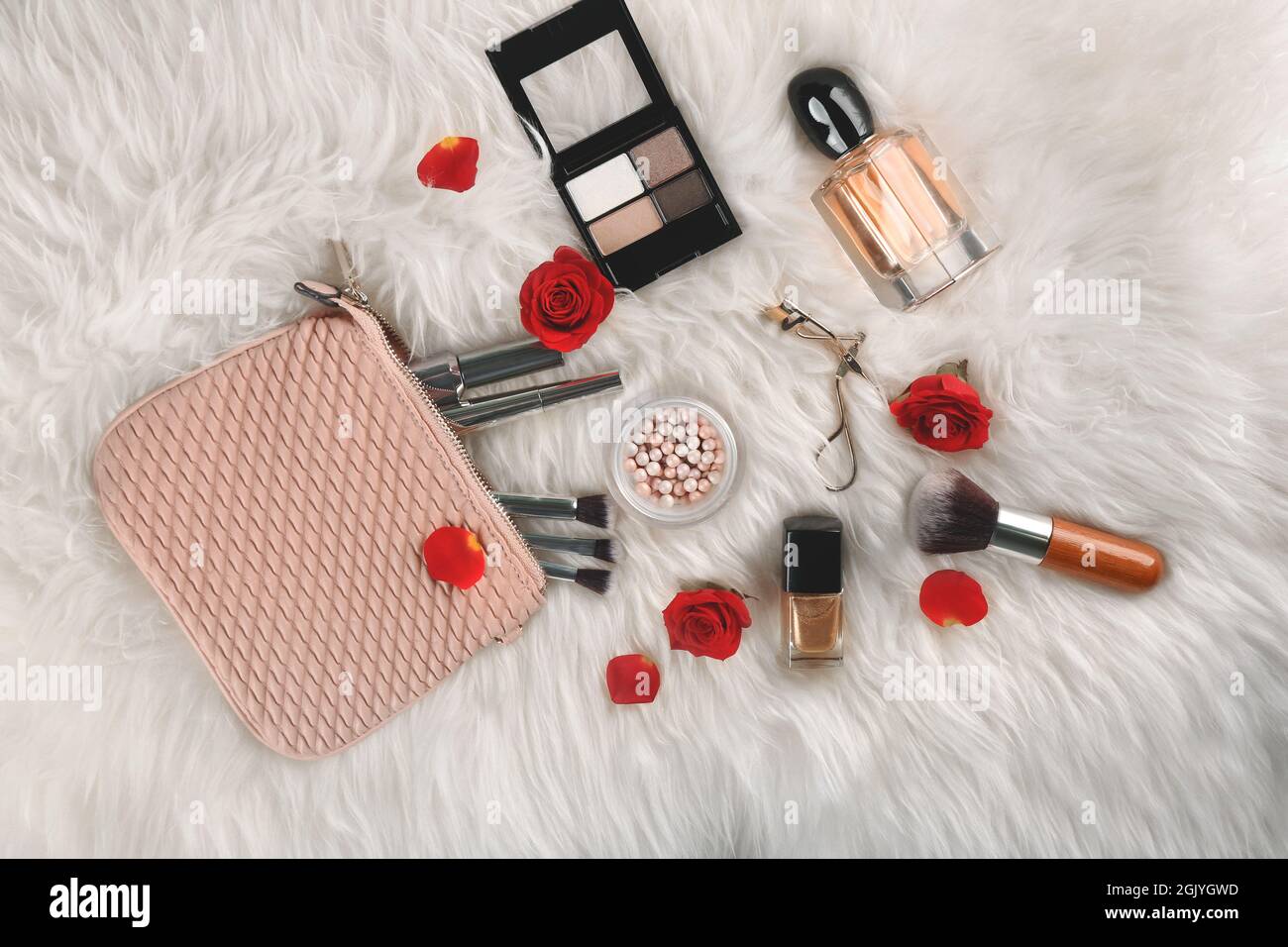 Cosmetics and perfume on furry background Stock Photo - Alamy