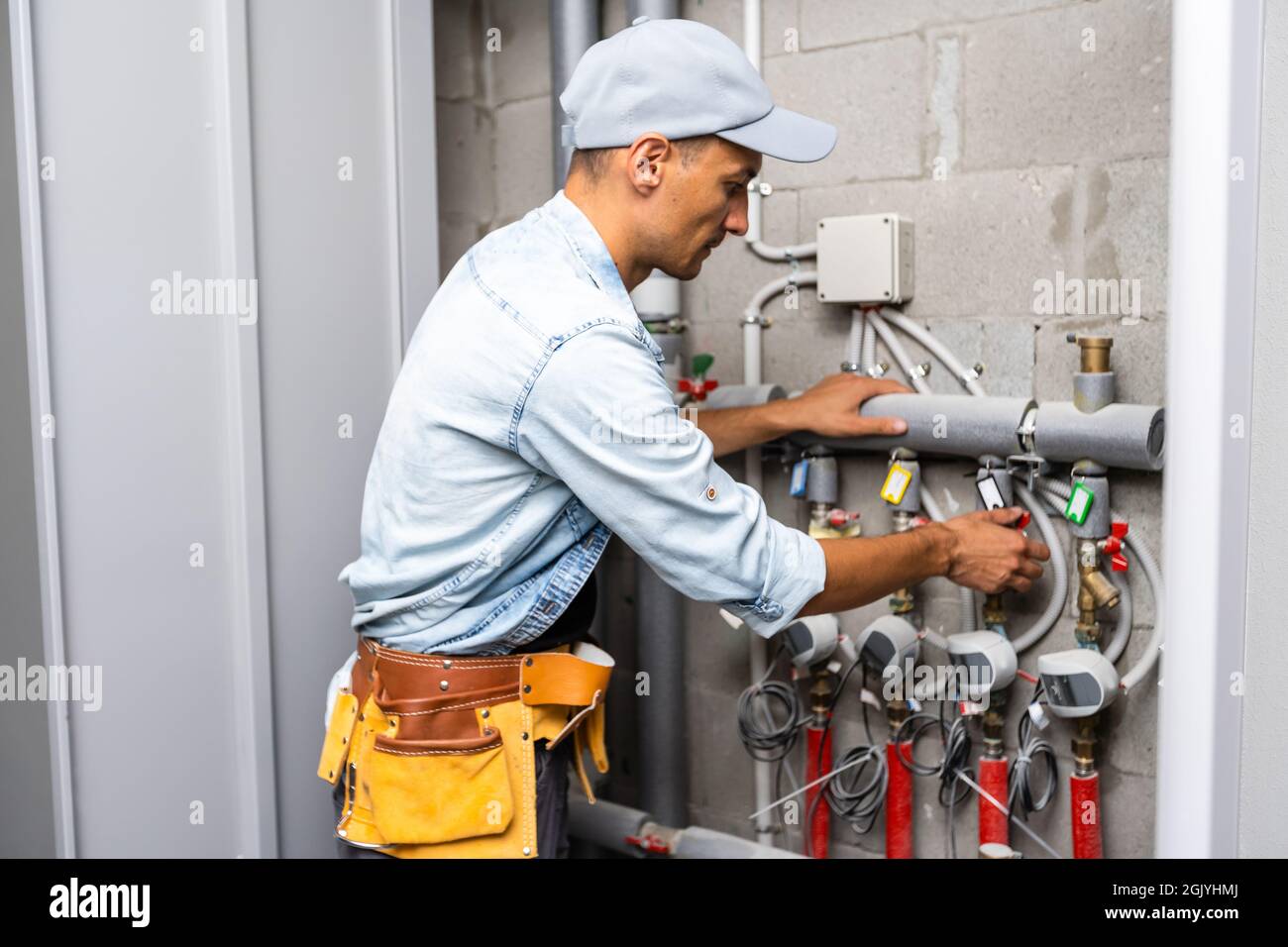 Plumber Repairing Water Pipes In Residential Building Stock Photo - Alamy
