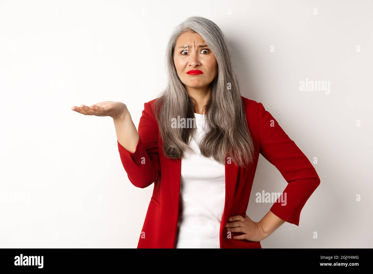 What is this. Confused and skeptical asian female entrepreneur pointing ...