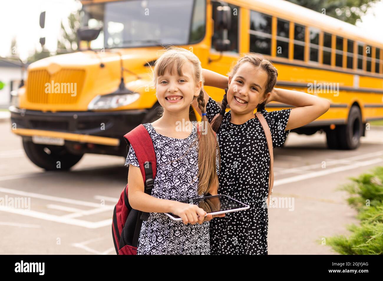 Basic school students crossing the road Stock Photo - Alamy