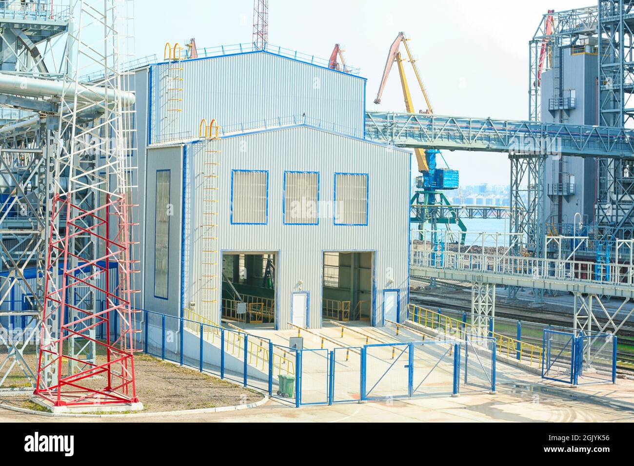 View of factory in sea port Stock Photo - Alamy