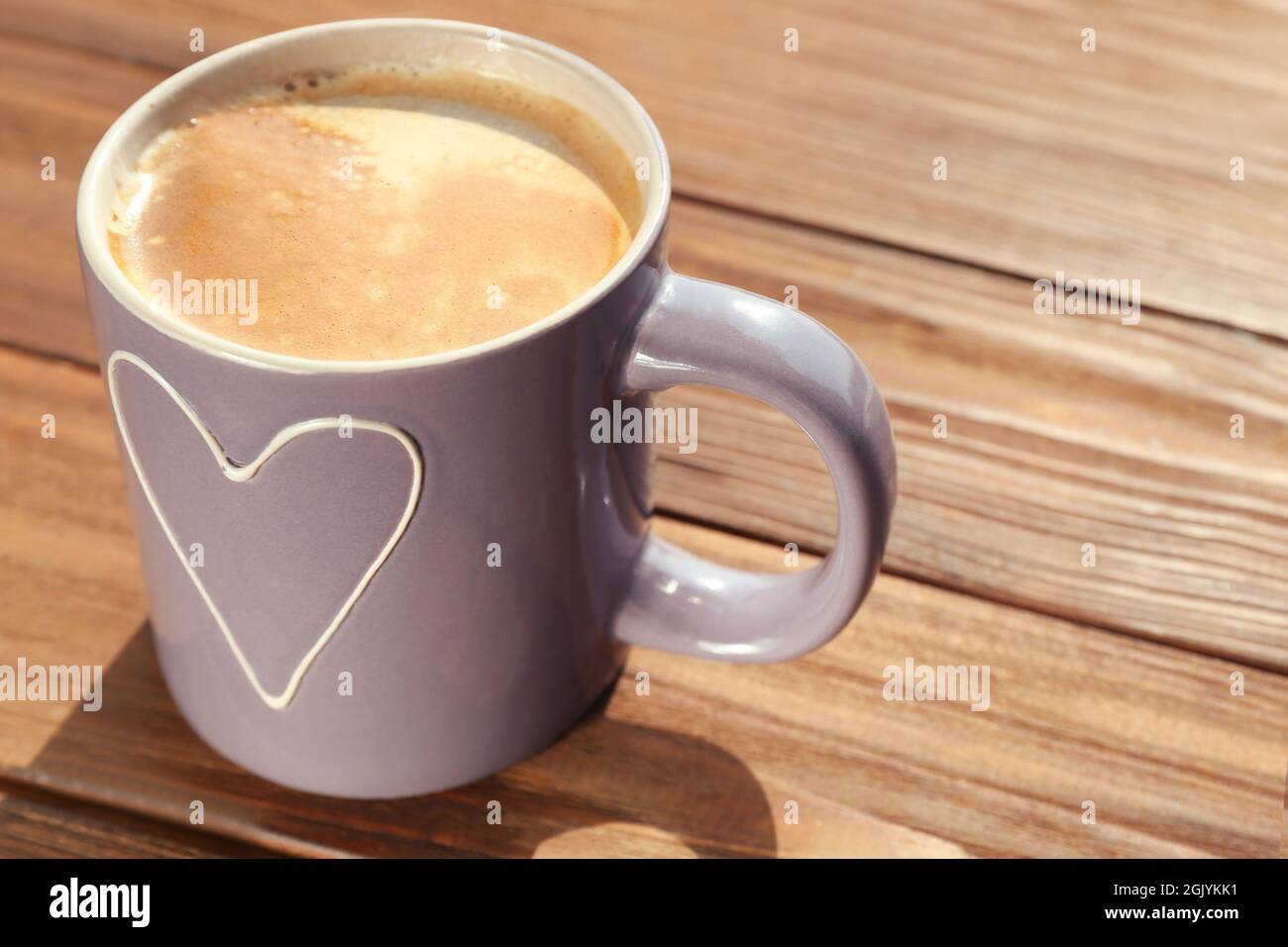 Cup with delicious coffee on wooden window sill Stock Photo - Alamy