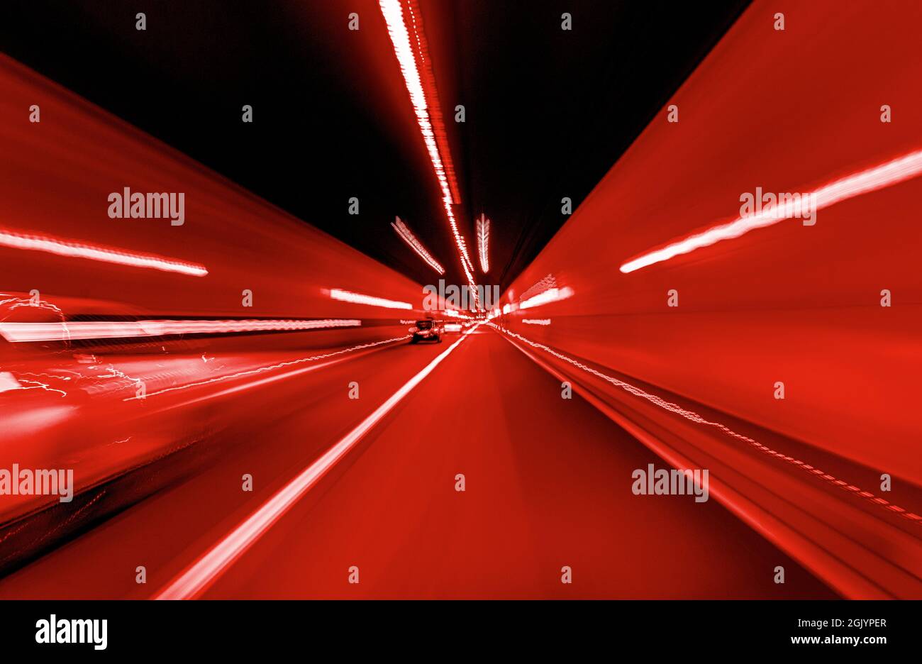 Cars rush through the tunnel in the beams of searchlights Stock Photo ...