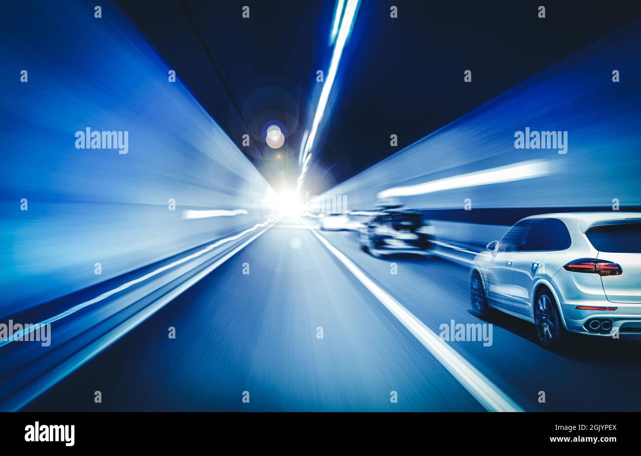 Cars rush through the tunnel in the beams of searchlights Stock Photo ...