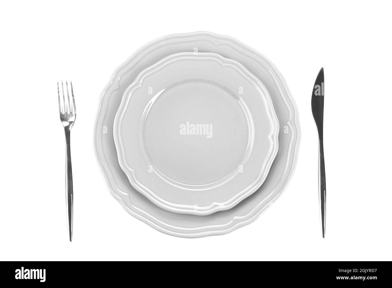 Table setting for one person on white background Stock Photo - Alamy