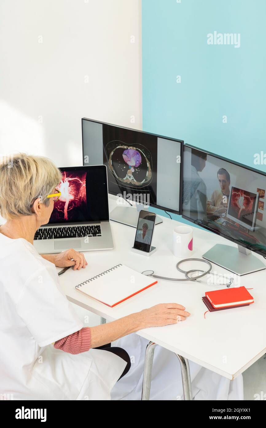 Teleconsultation between two doctors with medical images of stomachs on ...