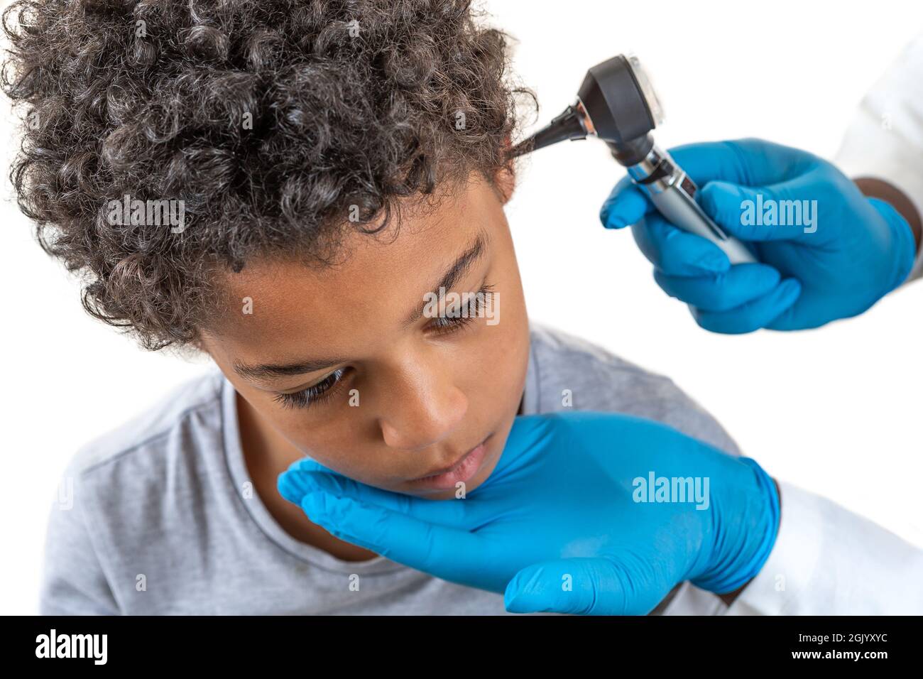 Otoscope Examination: Physician performing ear examination during a ...