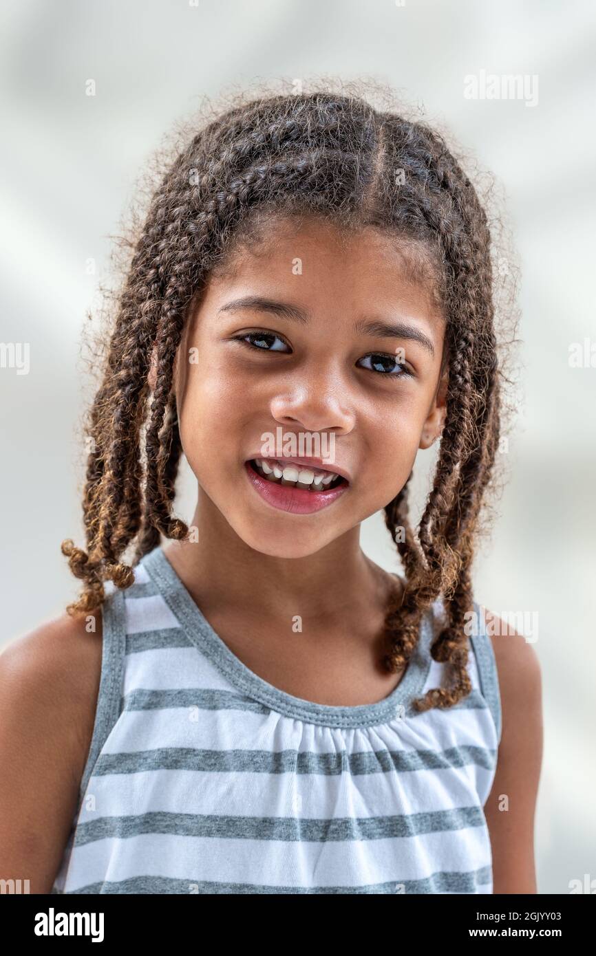 Little girl doing facial expressions face on white Stock Photo - Alamy