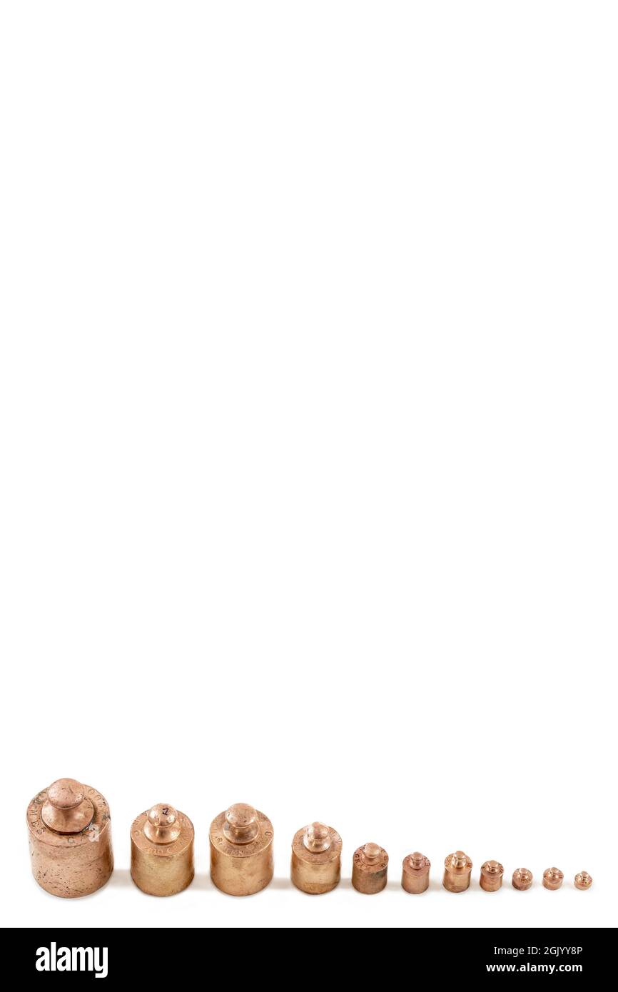 Set of precision weights for a balance scale isolated on white ...