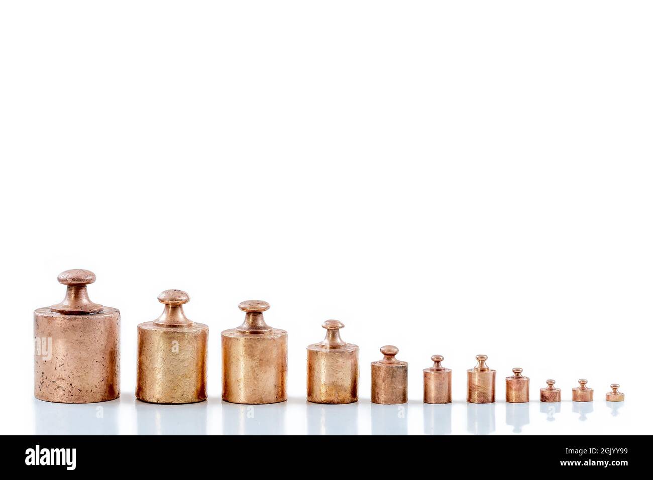 Set of precision weights for a balance scale isolated on white ...