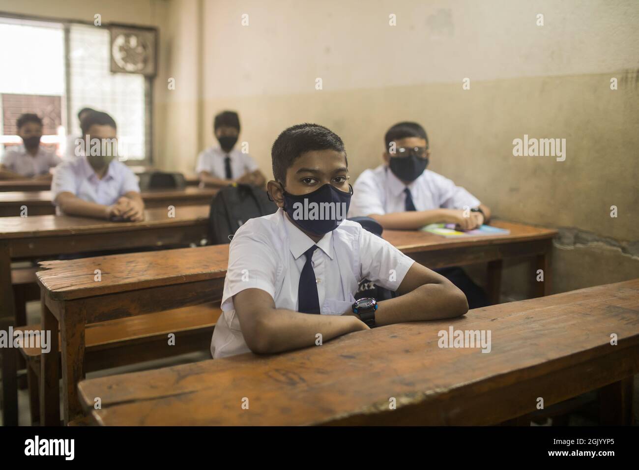 Students wearing face masks as a preventive measure against the spread ...