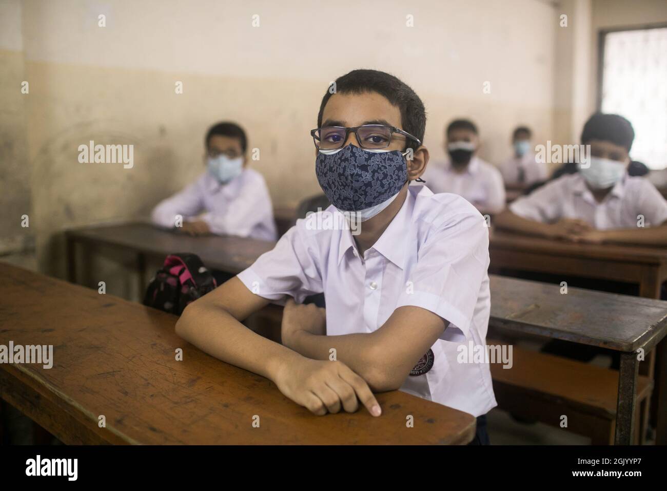 Students wearing face masks as a preventive measure against the spread ...
