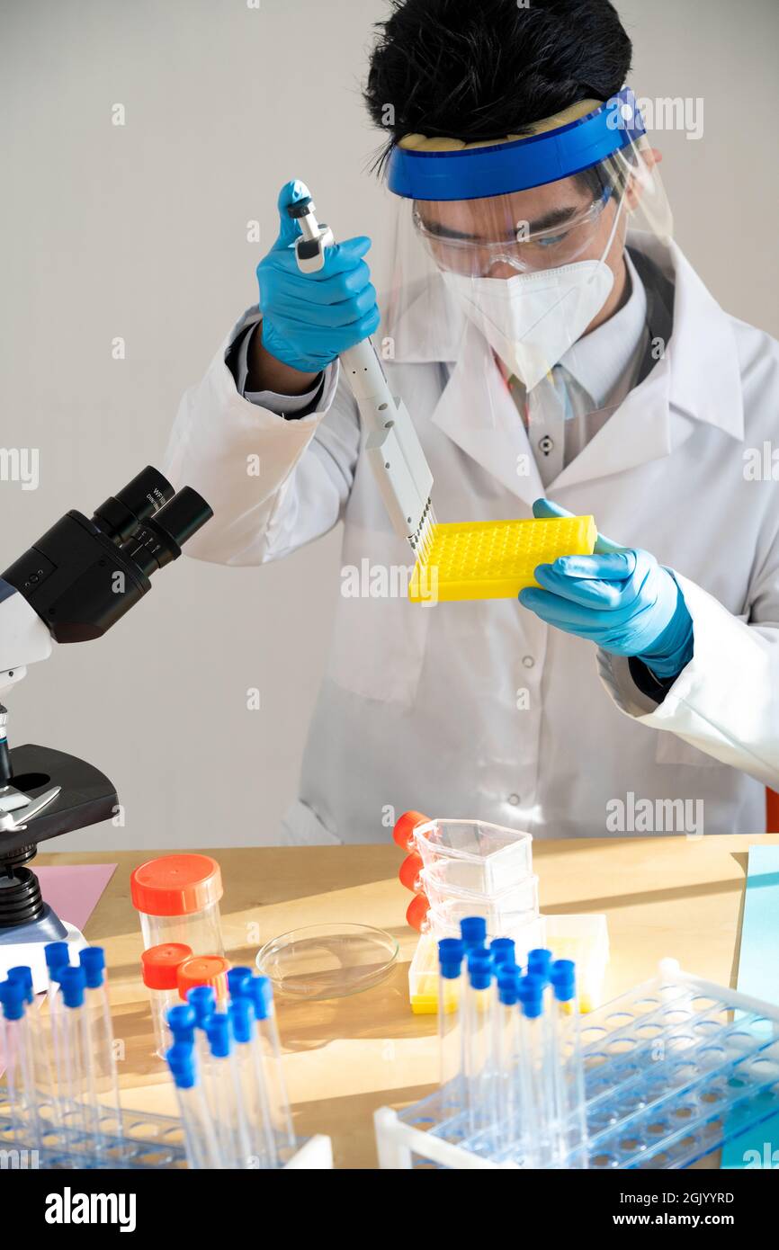 Laboratory assistant conducting experiments for laboratory research ...