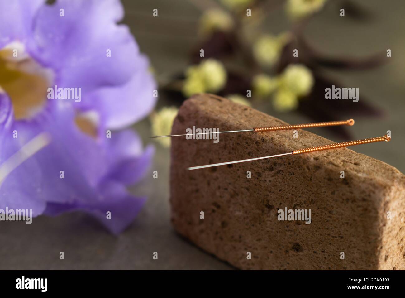 Closeup on an acupuncturist desk. Concept of treating diseases with ...