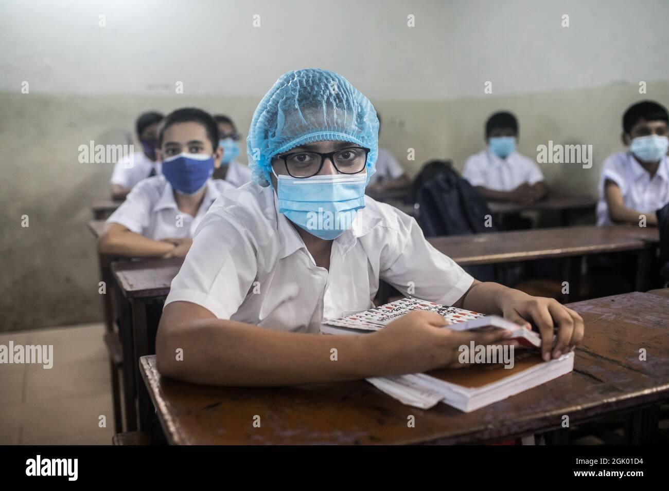 Students wearing face masks as a preventive measure against the spread ...