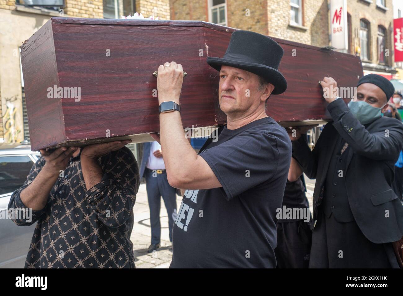 London, UK. 12th Sep 2021. A silent funeral march in black from Altab ...