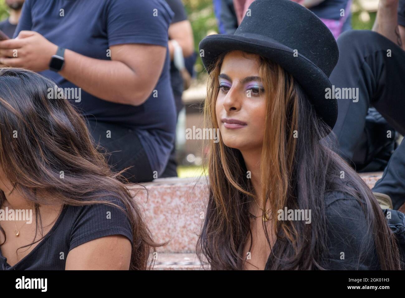 London, UK. 12th Sep 2021. A woman wears one of the black hats which ...
