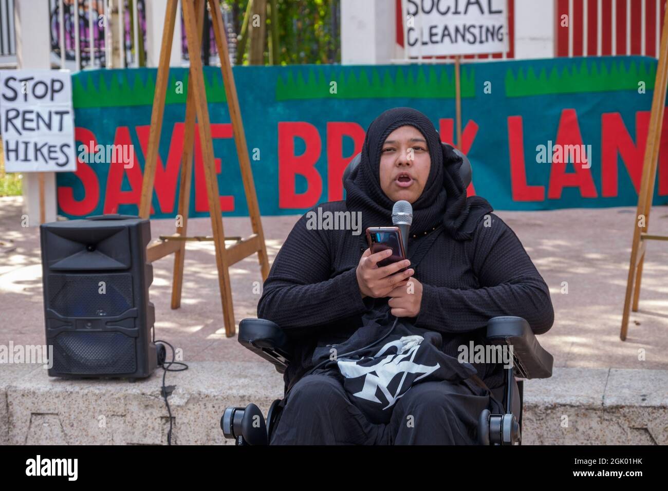 London, UK. 12th Sep 2021. A local activist speaks from her wheelchair ...