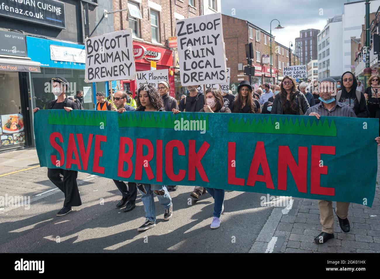 London, UK. 12th Sep 2021. A silent funeral march in black from Altab ...