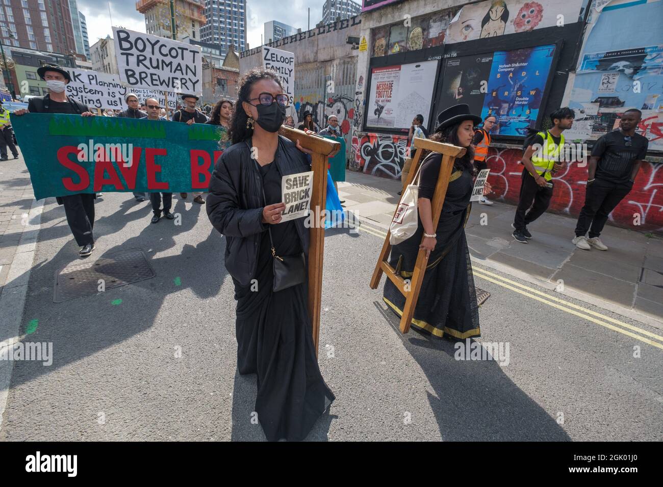 London, UK. 12th Sep 2021. A silent funeral march in black from Altab ...