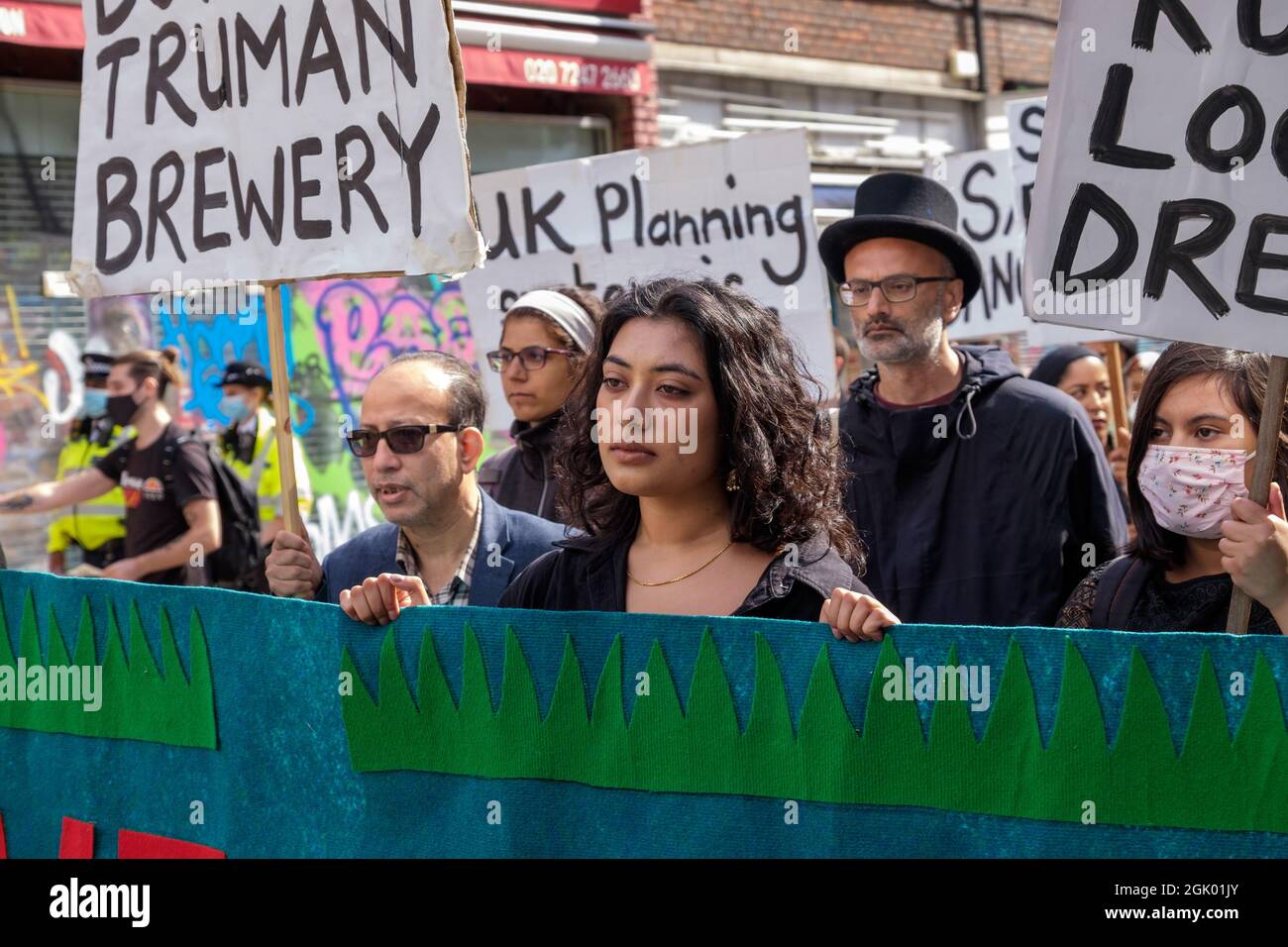 London, UK. 12th Sep 2021. A silent funeral march in black from Altab ...