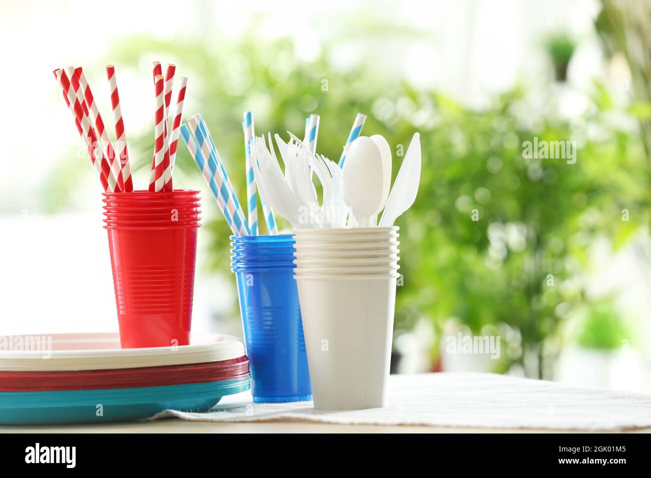 Plastic ware on table outdoors Stock Photo - Alamy