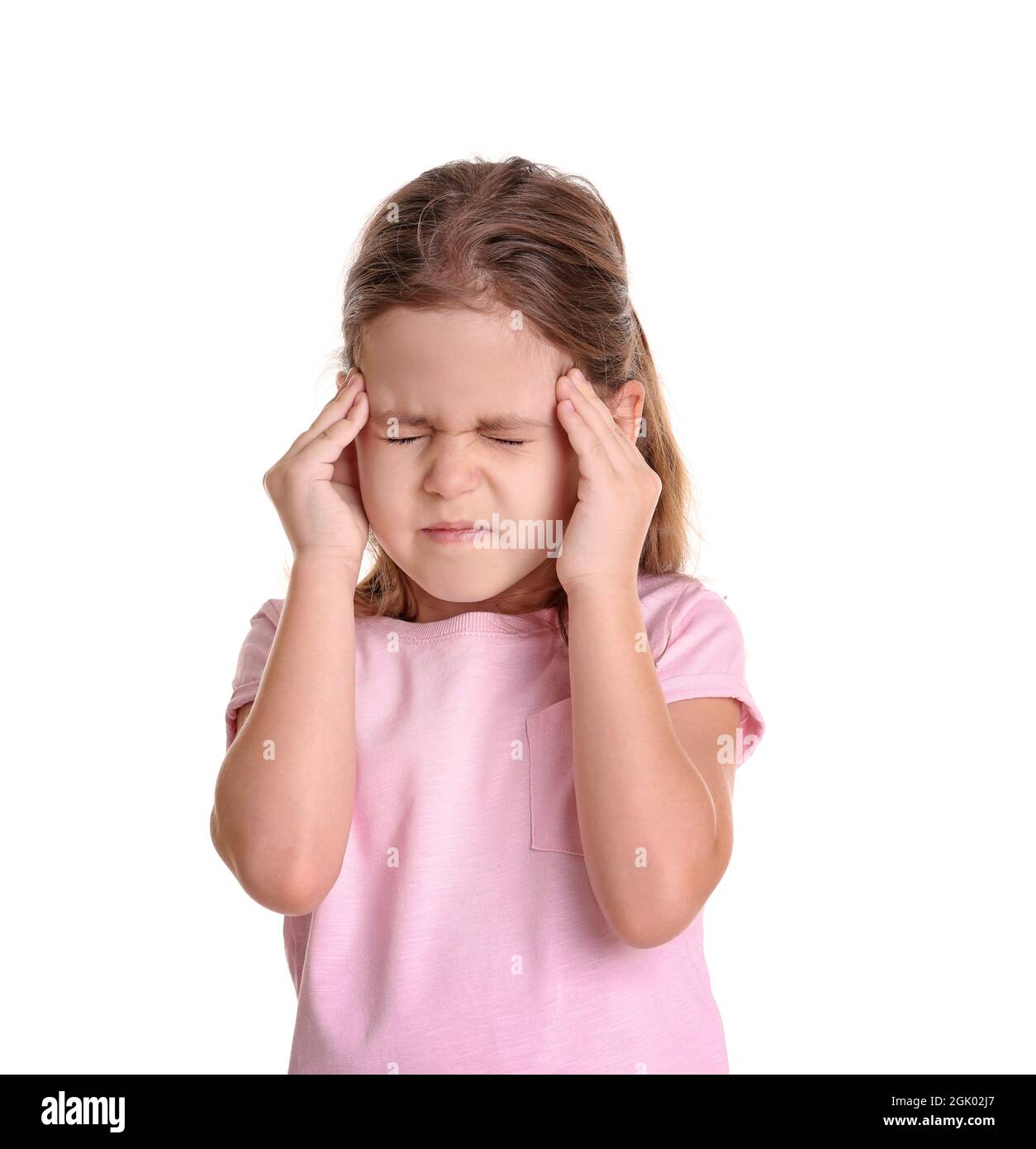 Little girl suffering from headache on white background Stock Photo - Alamy