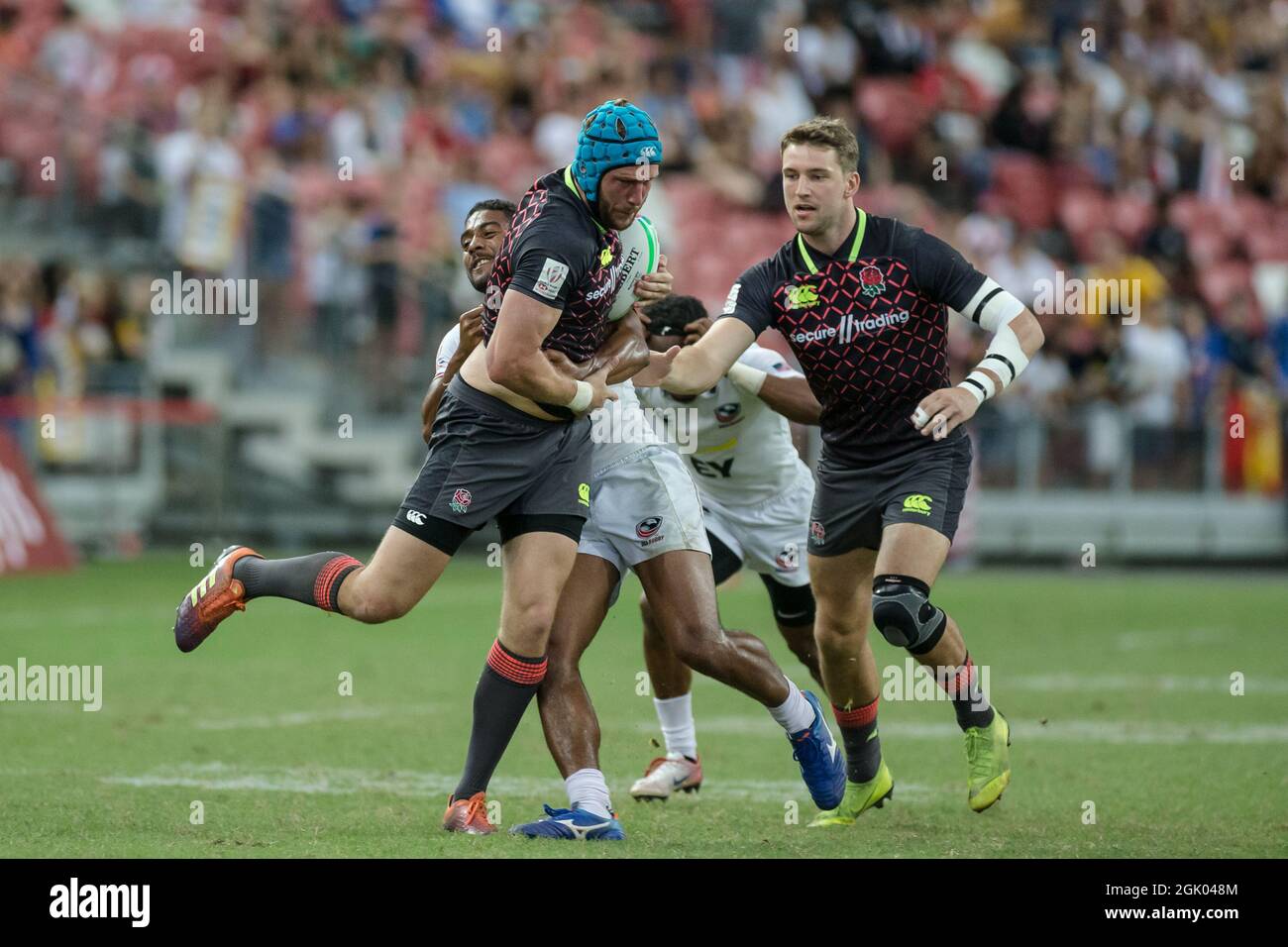 SINGAPORE-APRIL 14: England 7s Team (blue) plays against USA 7s team ...