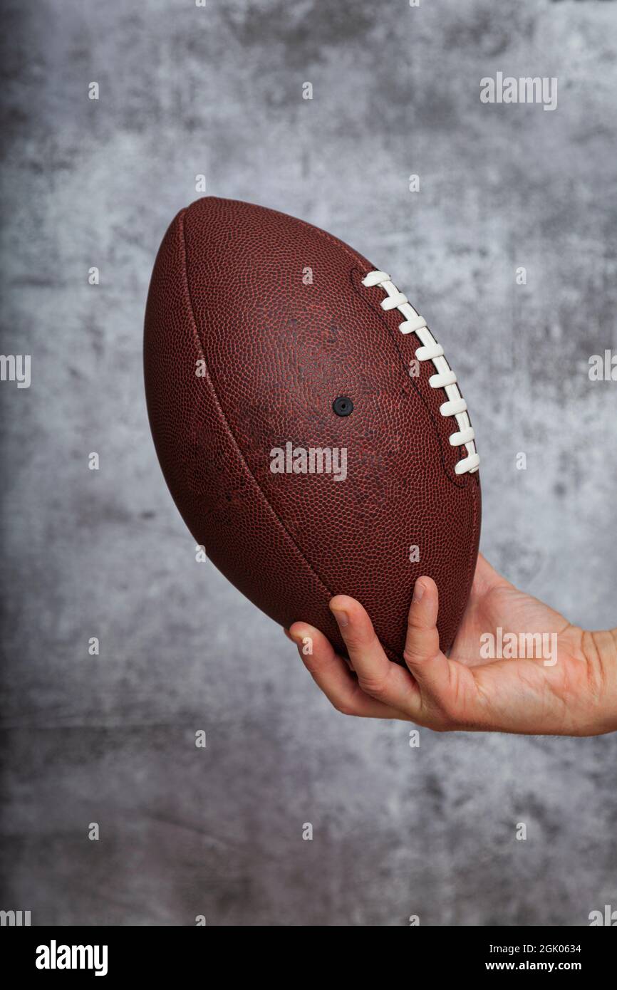 Football and hand hi-res stock photography and images - Alamy