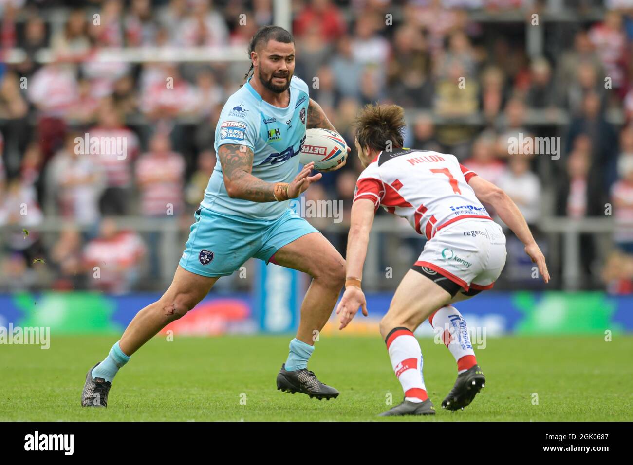 David Fifita (8) of Wakefield Trinity looks for a way past Joe Mellor ...